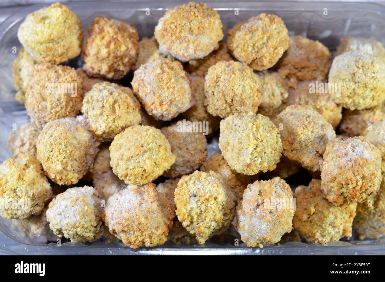 Frozen pre-fried Falafel, a deep-fried ball or patty-shaped fritter of ...