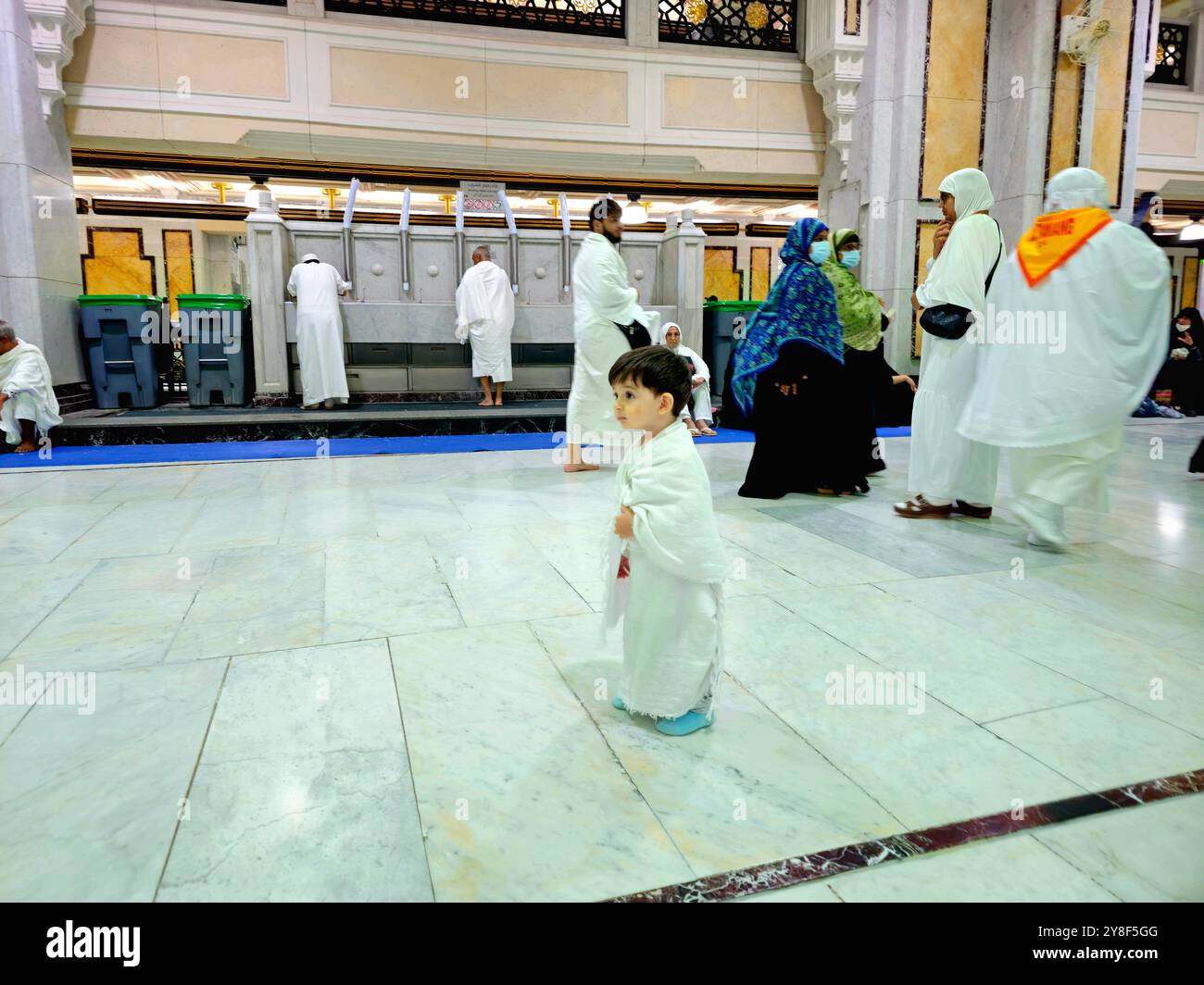Mecca, Saudi Arabia, June 8 2024: A young pilgrim child with the ...