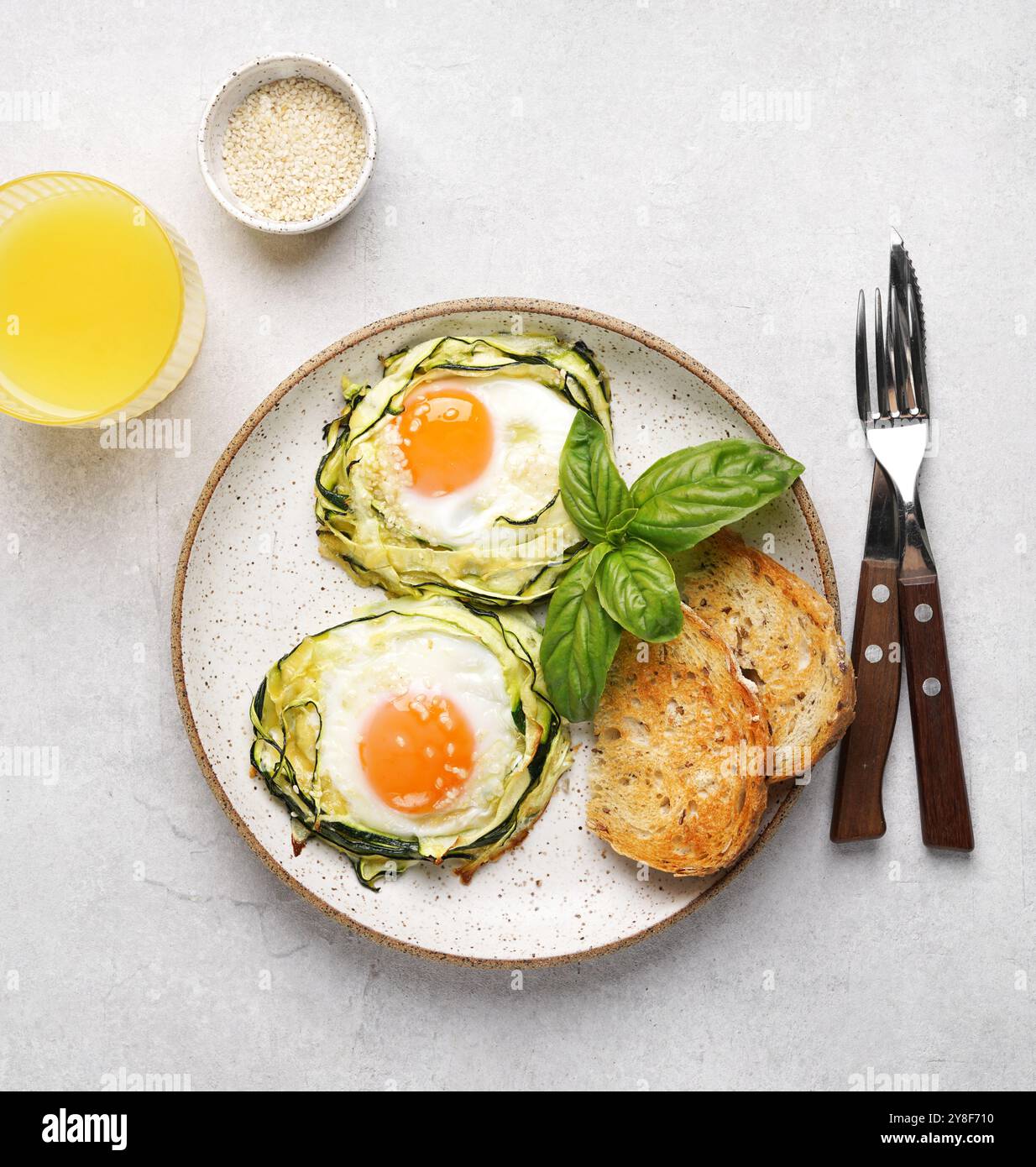 fried egg in zucchini noodle nest with sesame, healthy breakfast, top ...