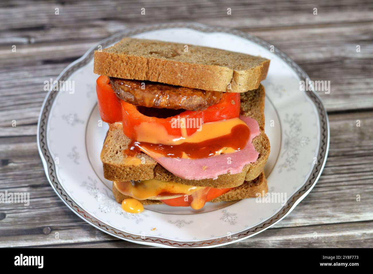 multilayer whole wheat brown toast filled with fried beef burger cooked ...