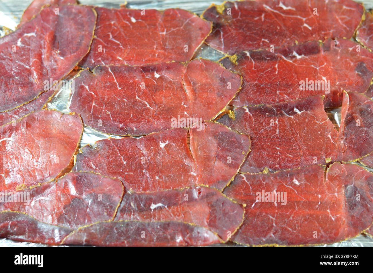 Thin slices of beef pastrami, made from beef brisket, raw meat is ...