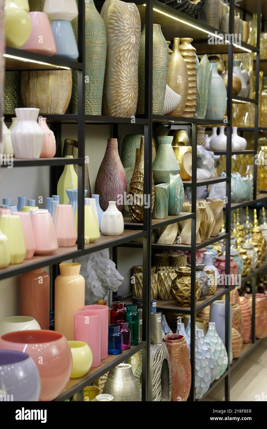 Variety of colorful ceramic vases and decor items on display in a ...