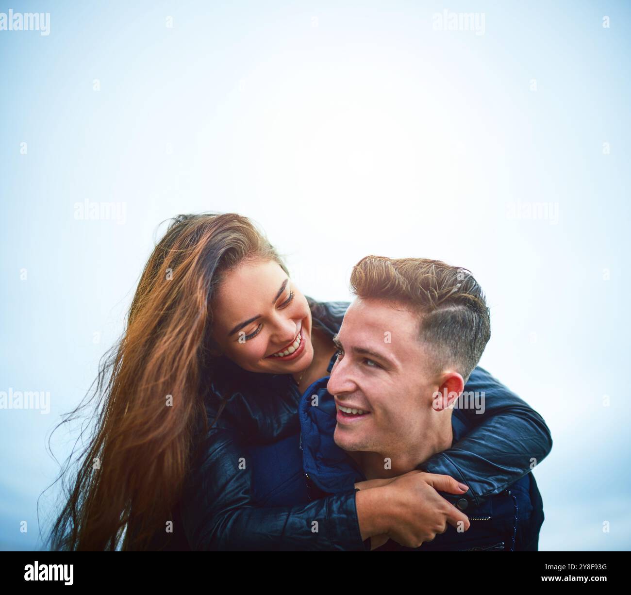 Couple, hug and outdoor with smile, love and piggy back on date with ...