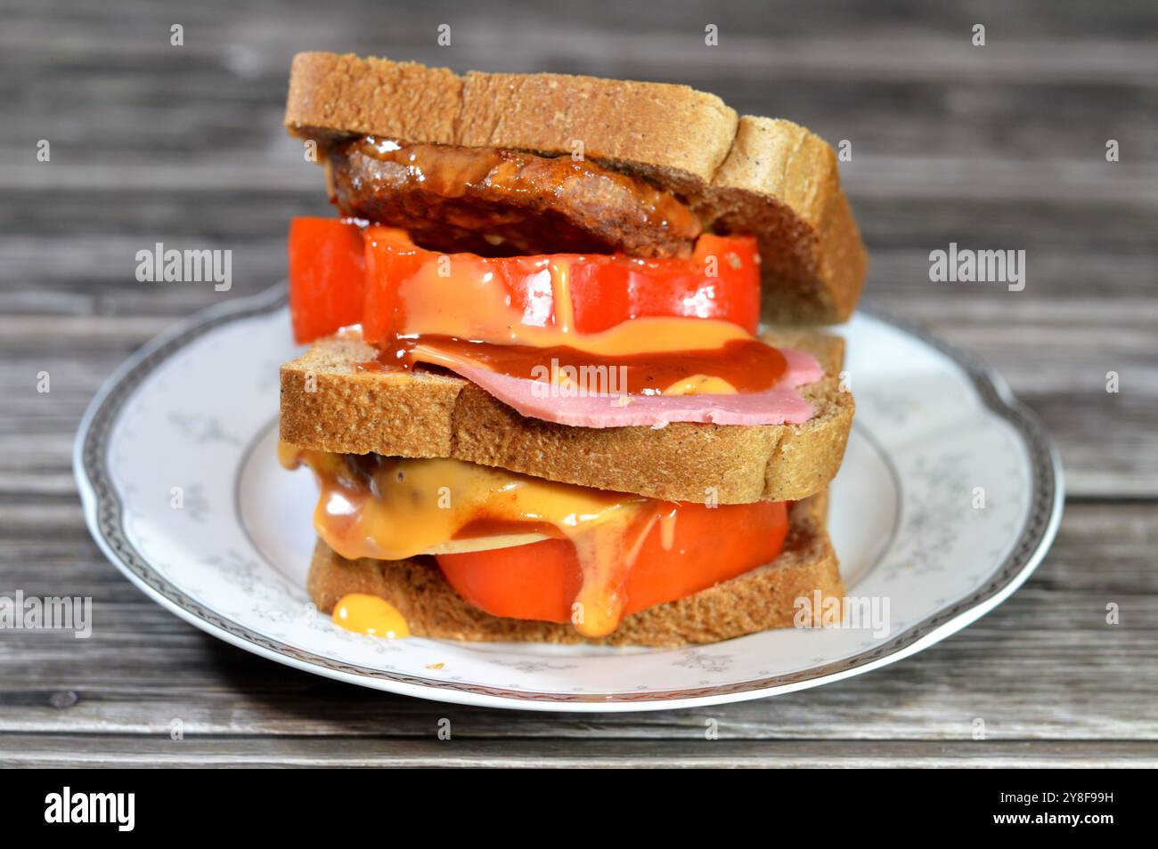 multilayer whole wheat brown toast filled with fried beef burger cooked ...