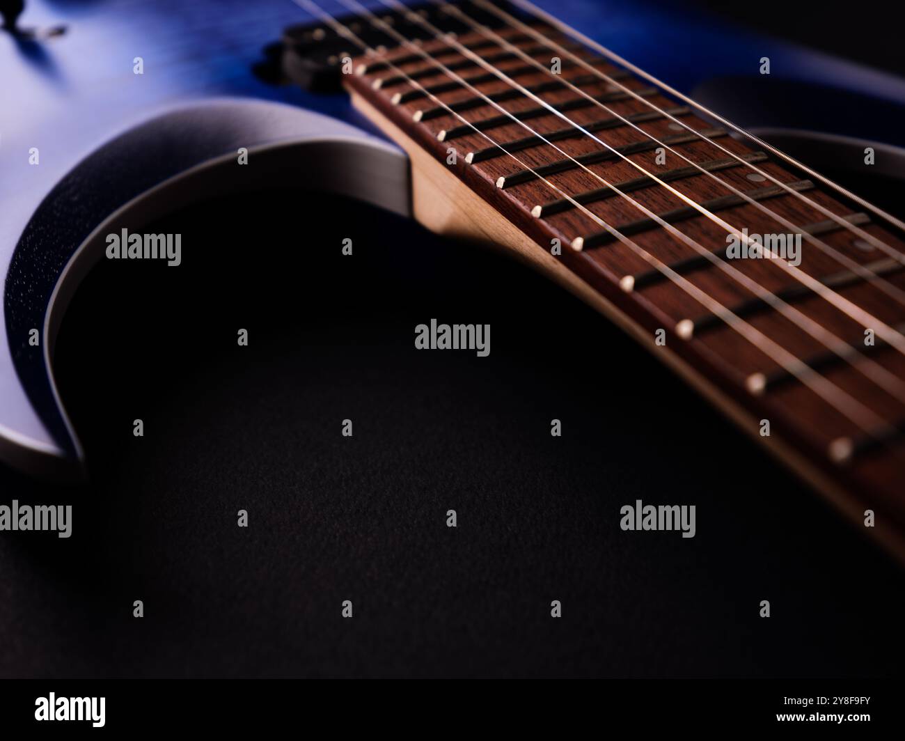 Fretboard of modern electric guitar. Close up Stock Photo - Alamy