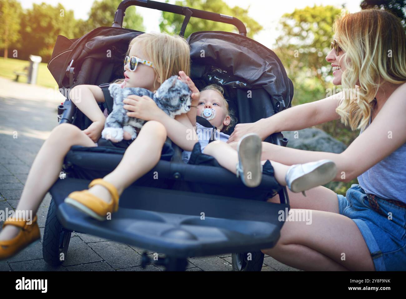 Mother, children and stroller outdoor for bonding, development and ...