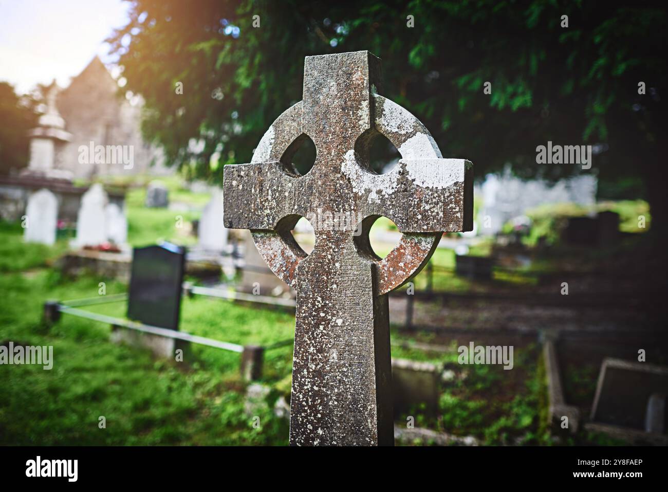 Celtic cross, old tombstone and graveyard for peace, remember and ...