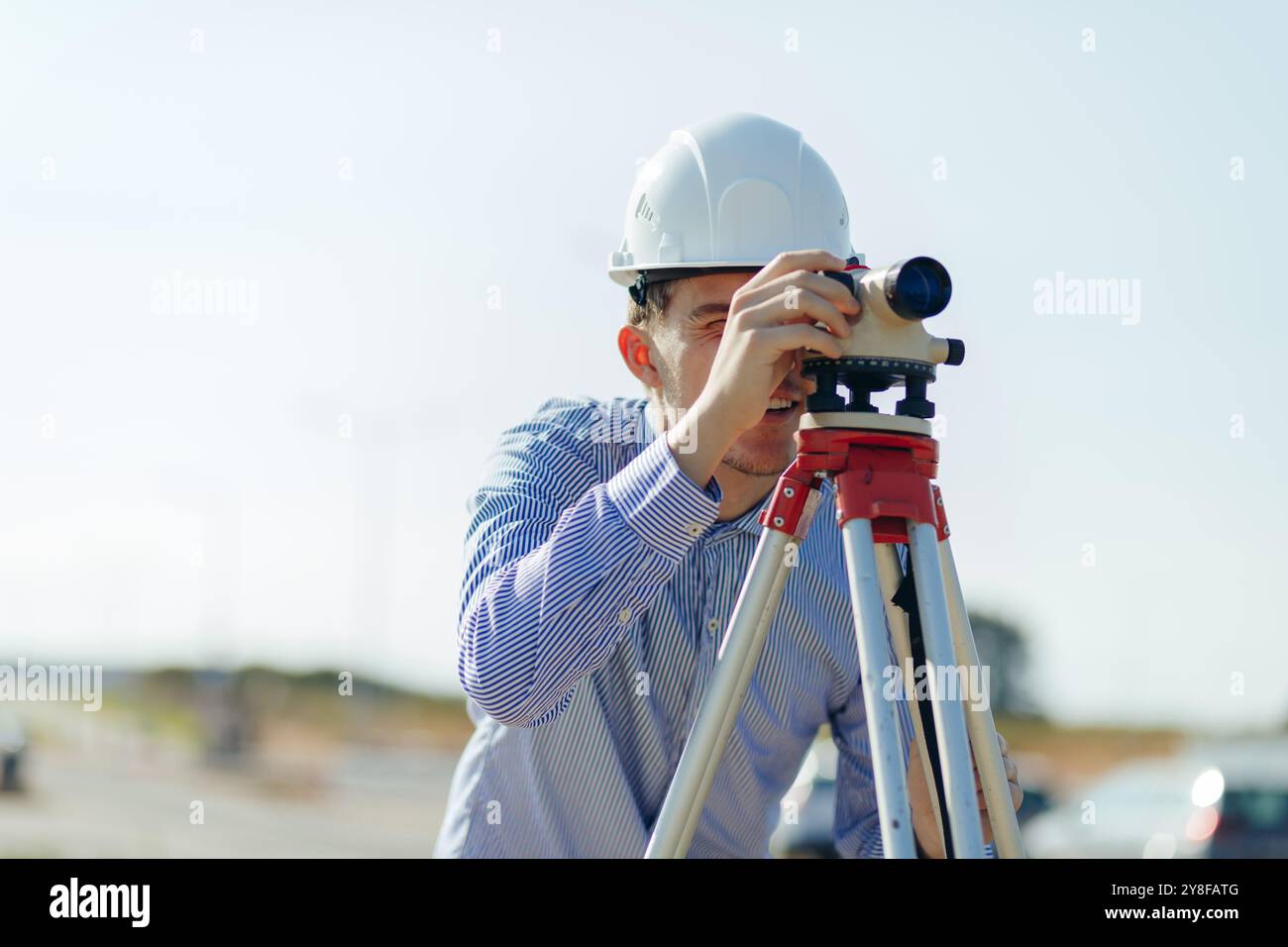 Survey engineer working with operating level survey cameras on ...