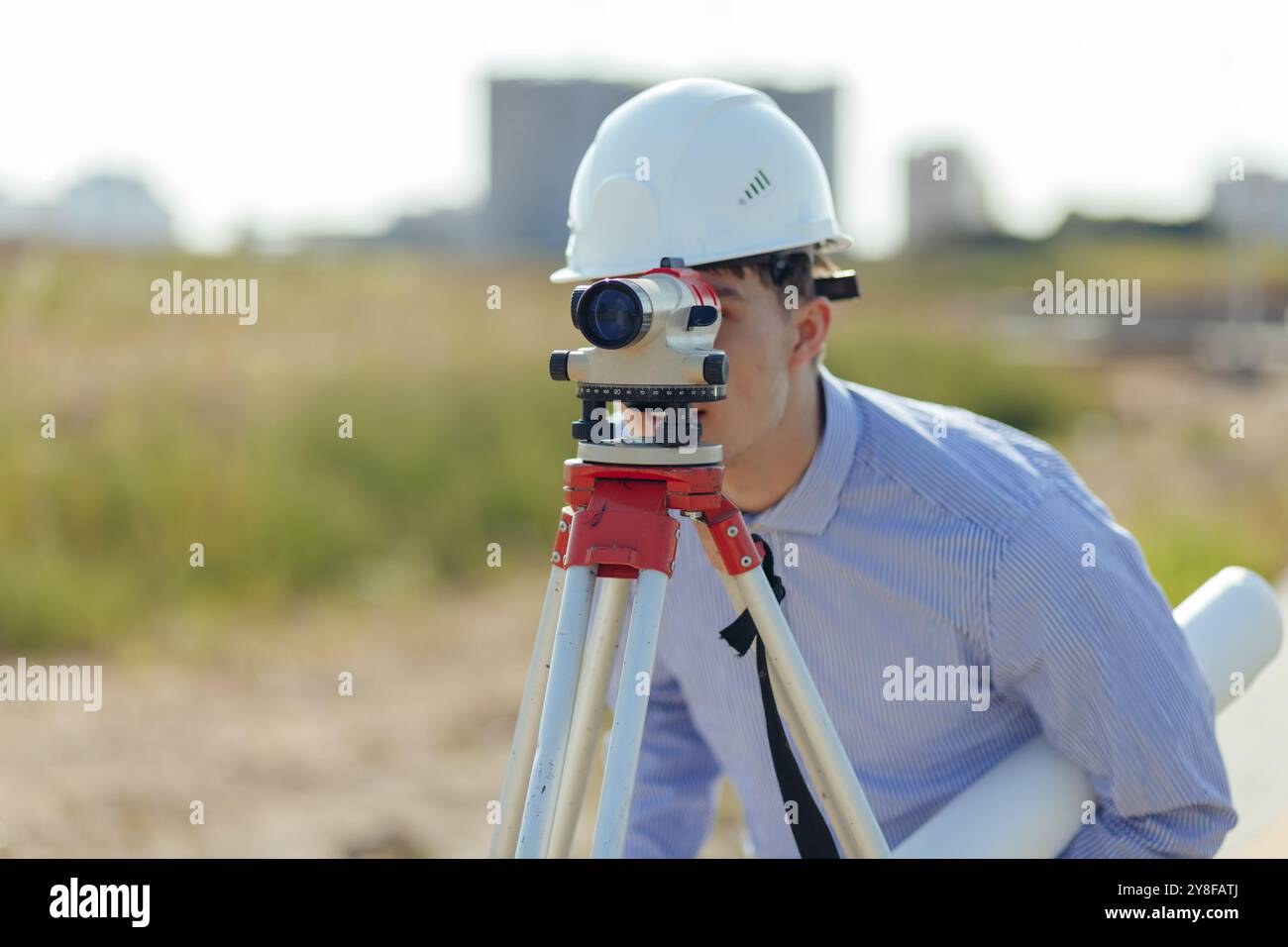 Survey engineer working with operating level survey cameras on ...