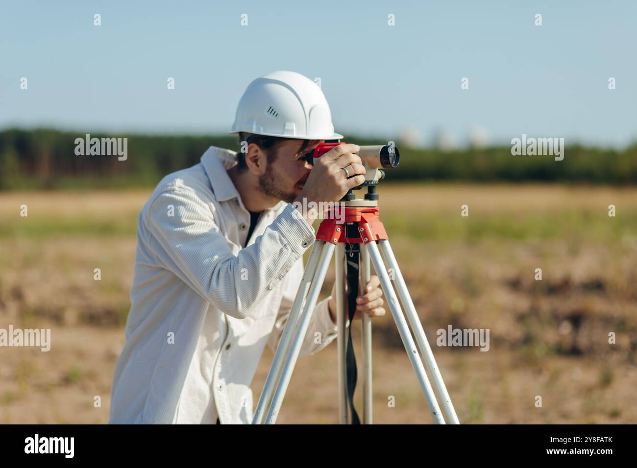 Operating surveying equipment hi-res stock photography and images - Alamy