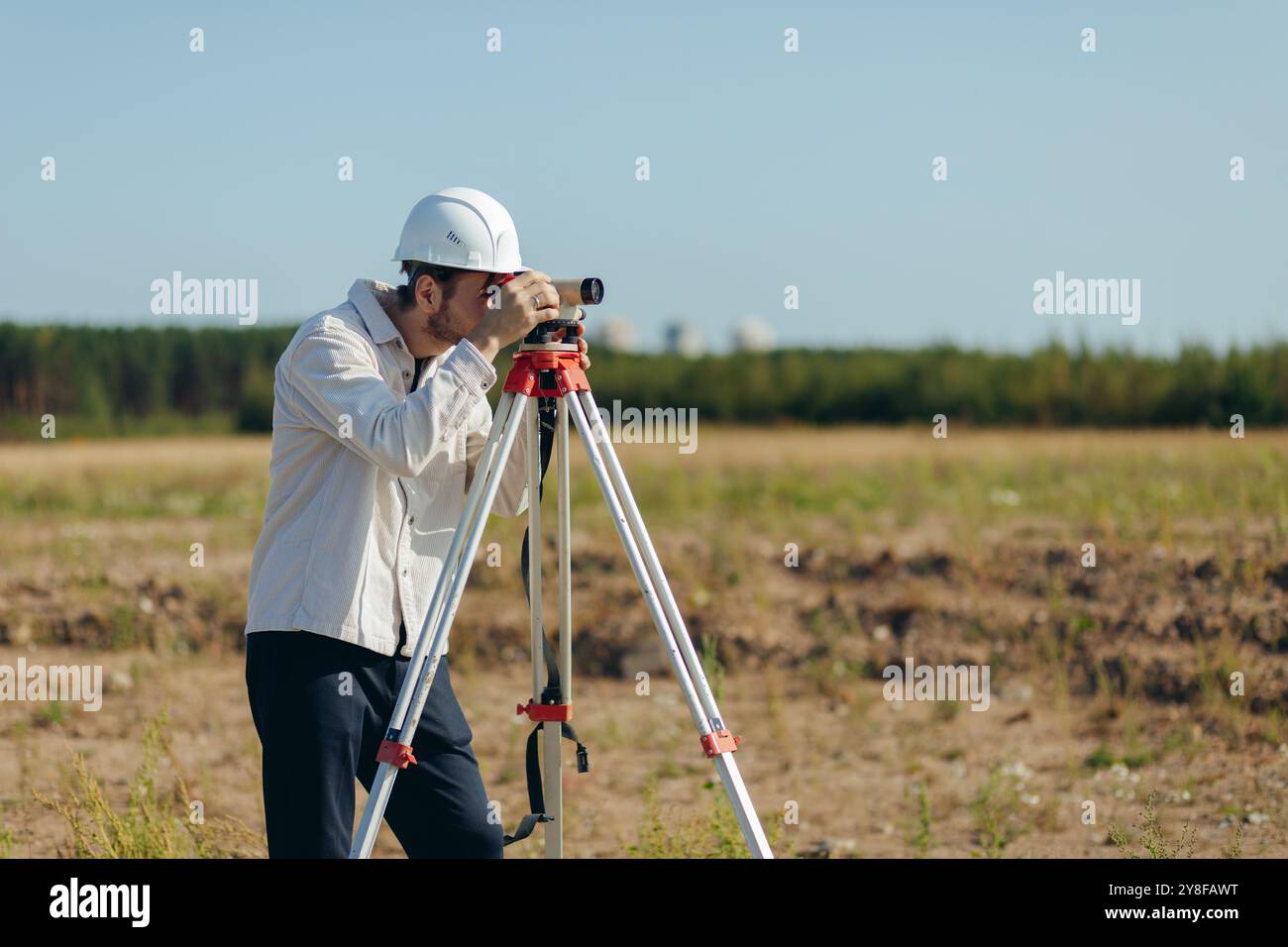 Survey engineer working with operating level survey cameras on ...