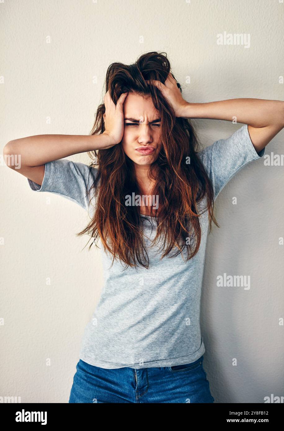 Mental health, anxiety and woman in studio with hair pulling, anger and ...