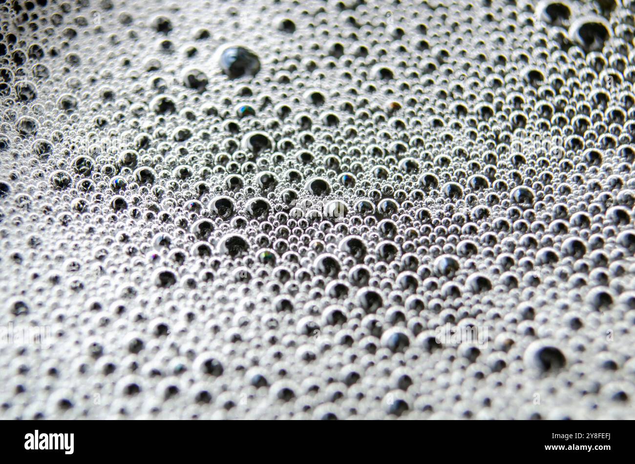 Top view of tiny bubbles on dark background. Suitable for wallpaper or ...