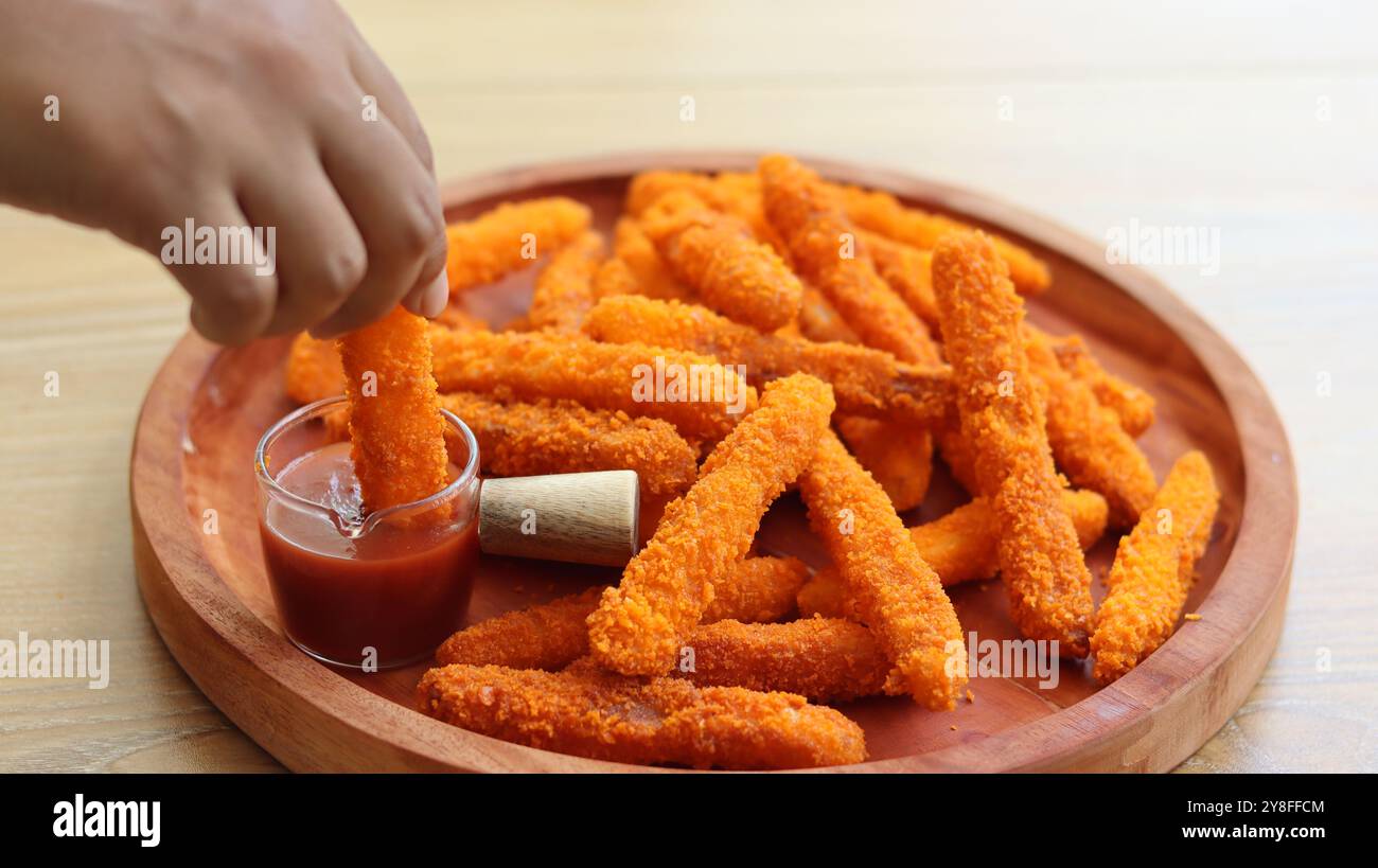 Crispy Fried Snacks with Dipping Sauce on Wooden Plate Stock Photo - Alamy