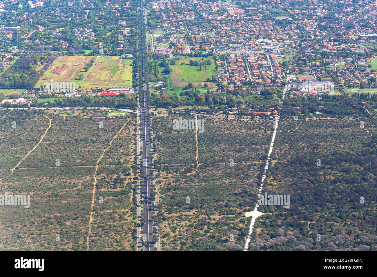 Aerial view over buildings streets and greenery. Overhead perspective ...