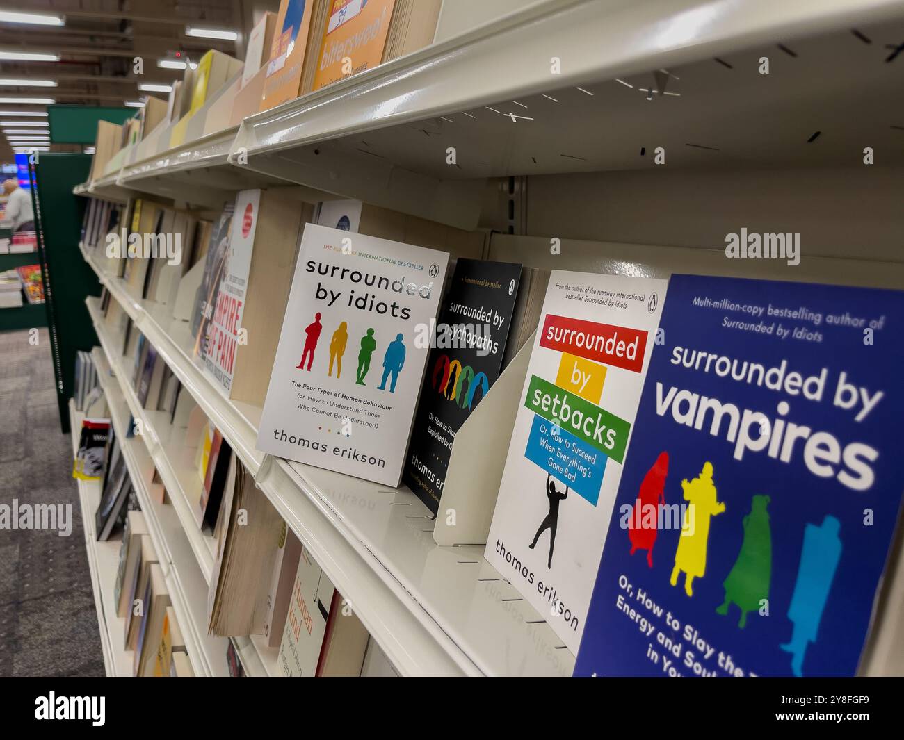 Bookshelf with various books in row at book store. Doha, Qatar OCT 05 ...
