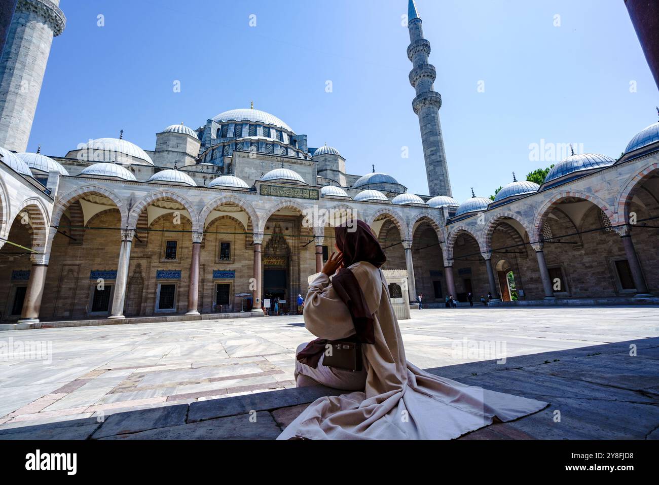 Turkiye. Istanbul. A woman wearing traditional dress admire the ...