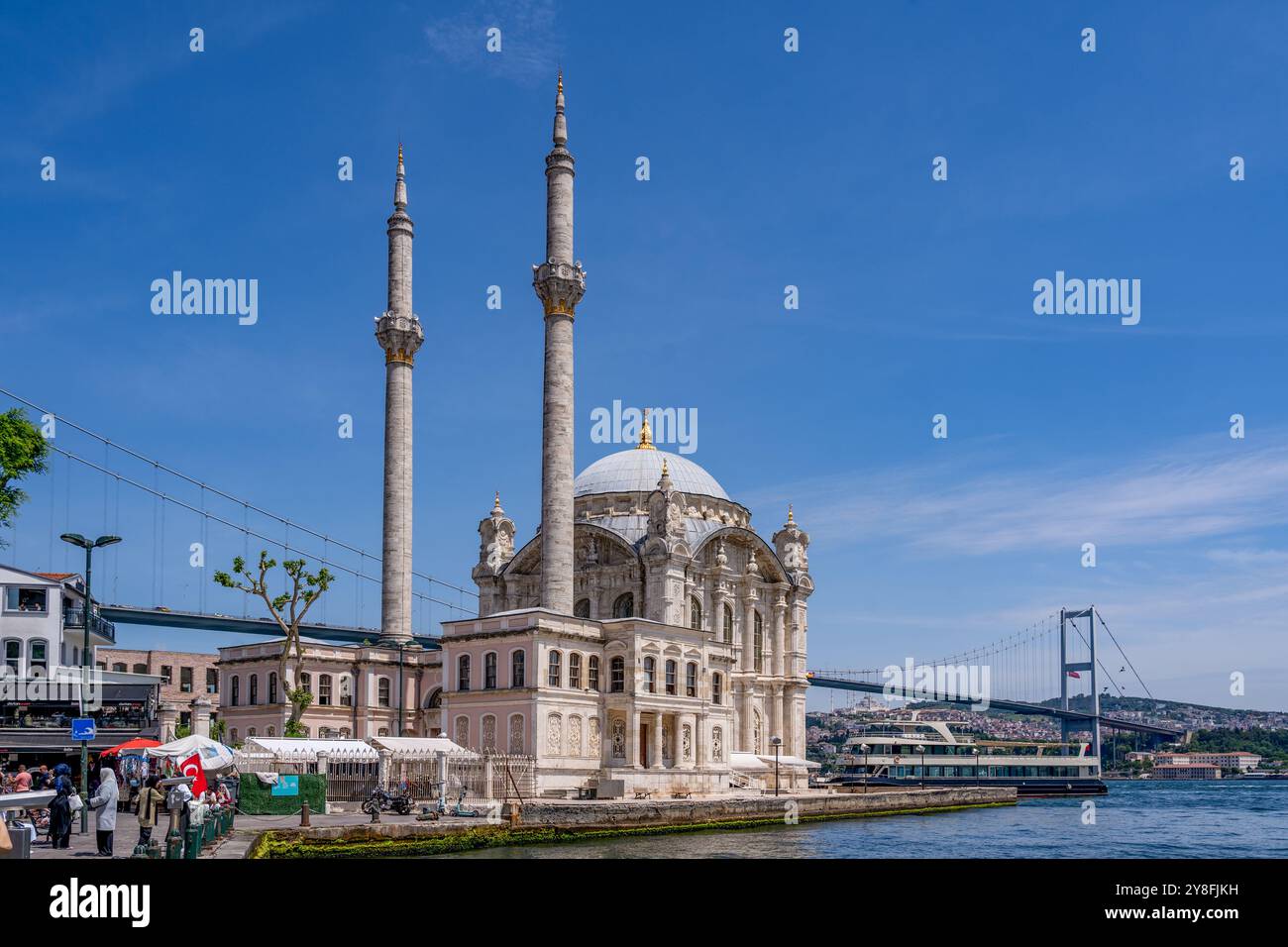 Turkiye. Istanbul. A cruise ship docks in front of the Ortakoy Mosque ...