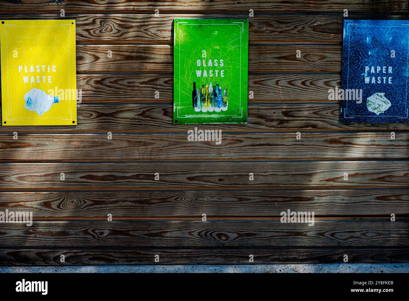 A photograph showing a mixture of discarded glass bottles, plastic ...