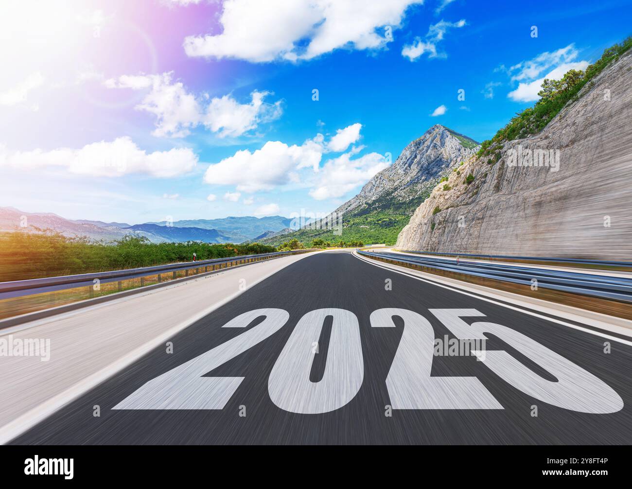 Asphalt road with the number 2025 New Year Stock Photo - Alamy