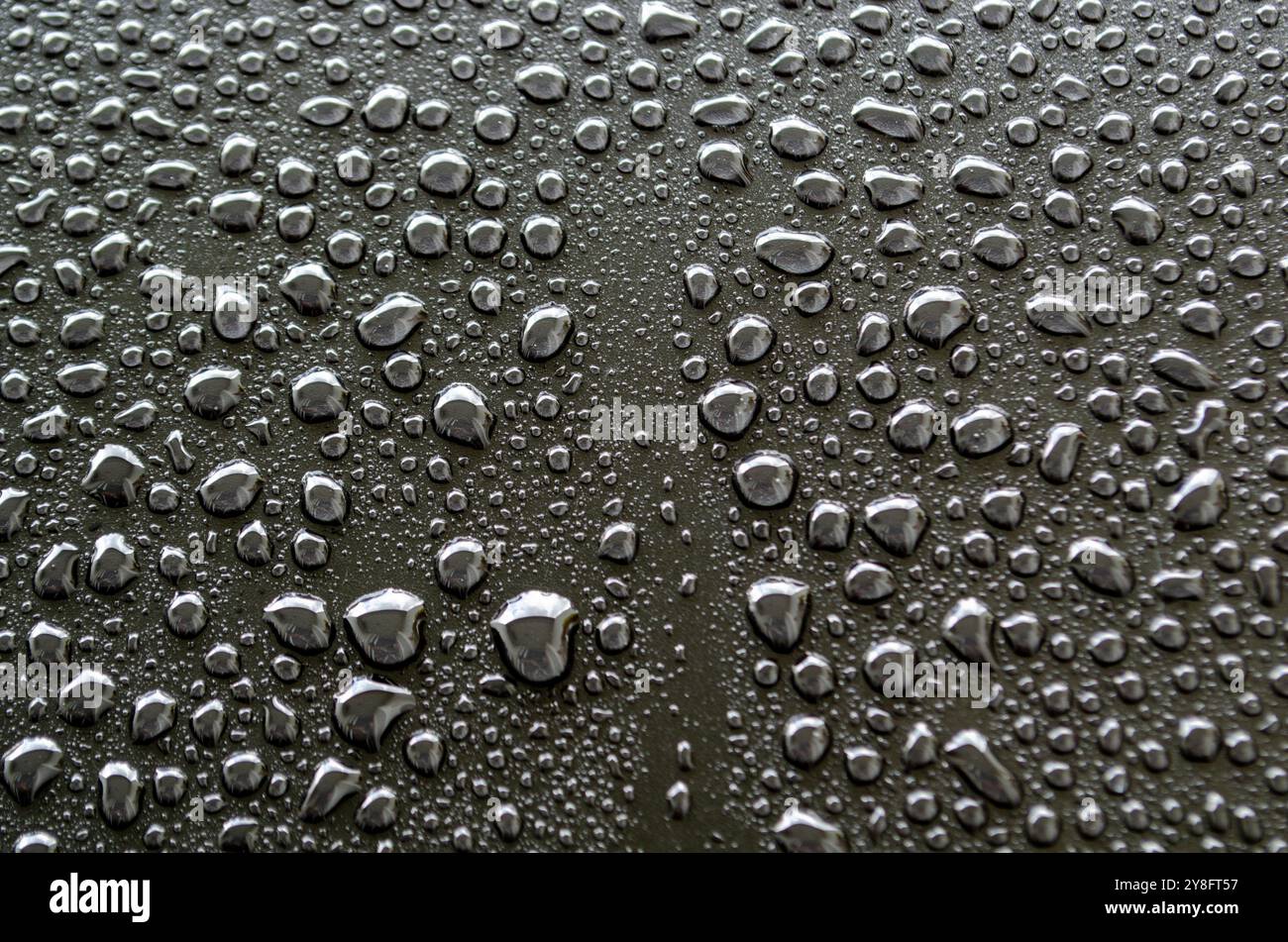 Close up view of rain droplets on dark cover background. Rain droplets ...