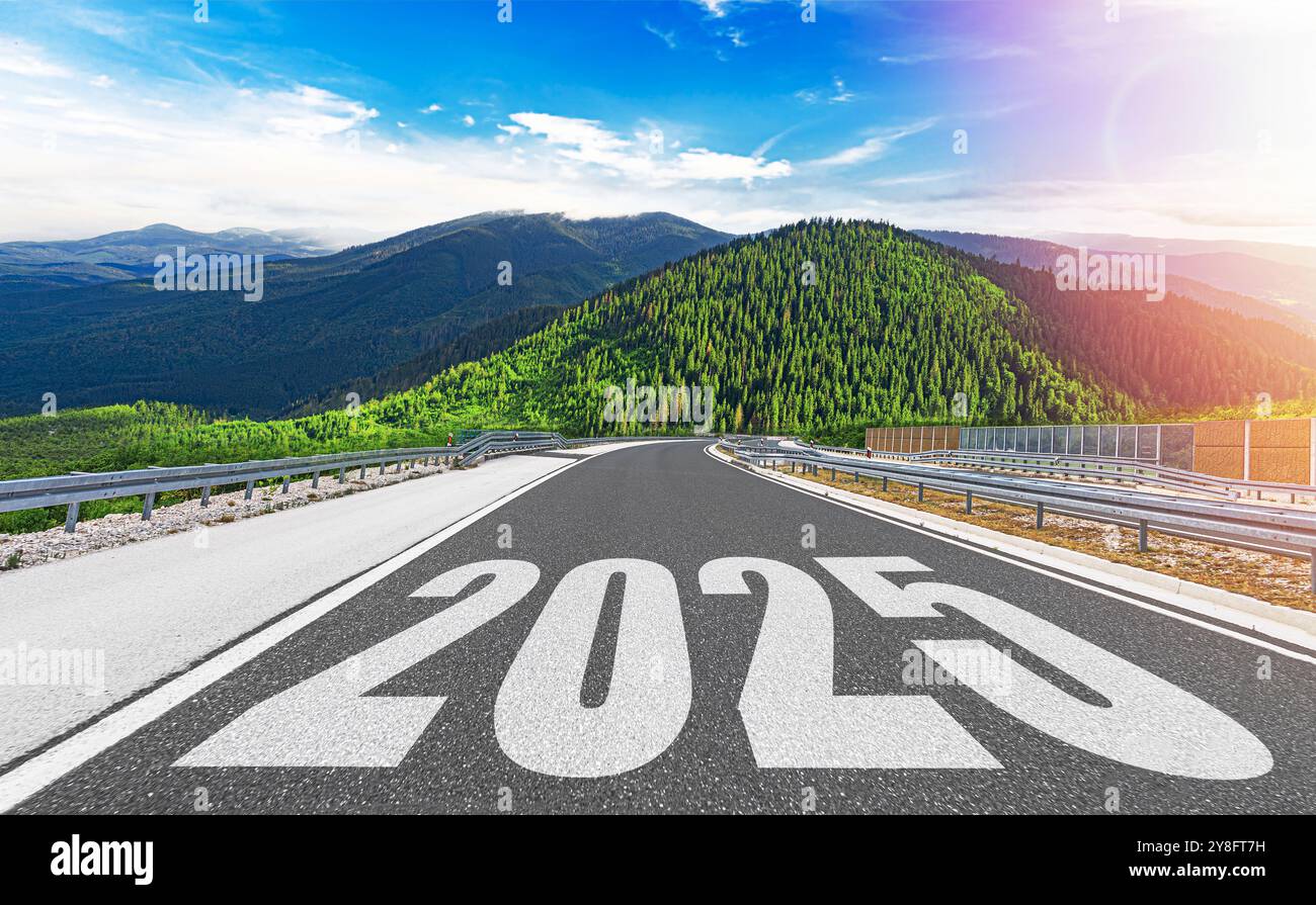 Asphalt road with the number 2025 New Year Stock Photo - Alamy