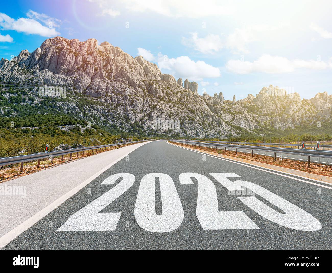 Asphalt road with the number 2025 New Year Stock Photo - Alamy