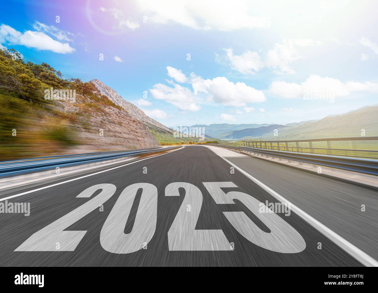 Asphalt road with the number 2025 New Year Stock Photo - Alamy