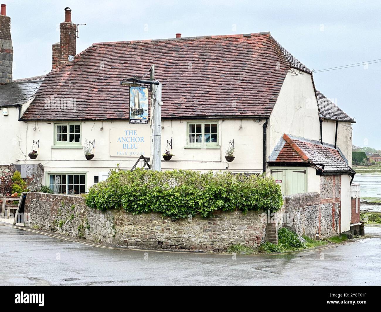 The Anchor Bleu pub, Bosham harbour, West Sussex, U.K Stock Photo - Alamy