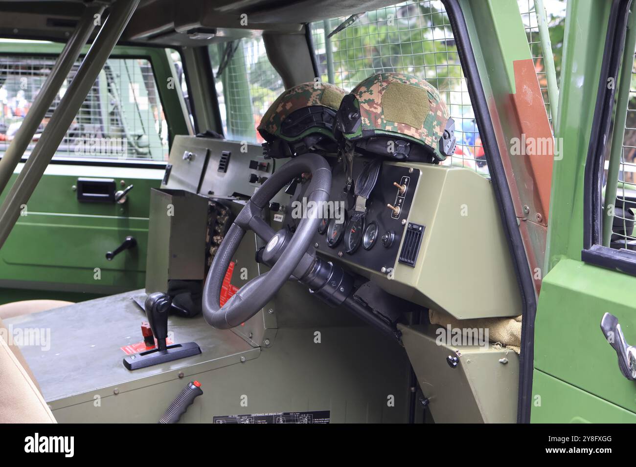 Detailed view of a military vehicle dashboard featuring the steering ...