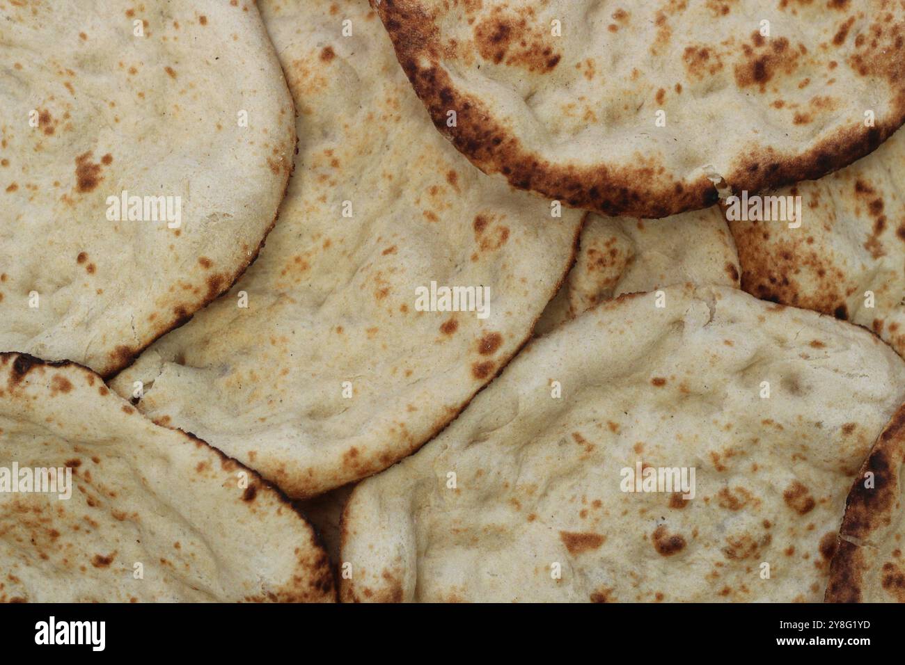 Baking bread in a tandoor oven using the traditional method in Hatay ...