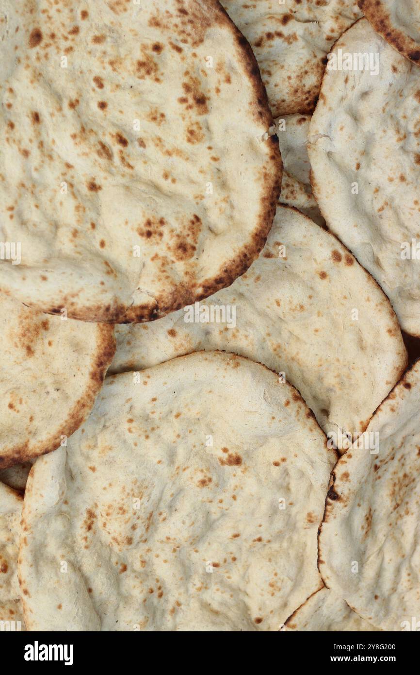 Baking bread in a tandoor oven using the traditional method in Hatay ...
