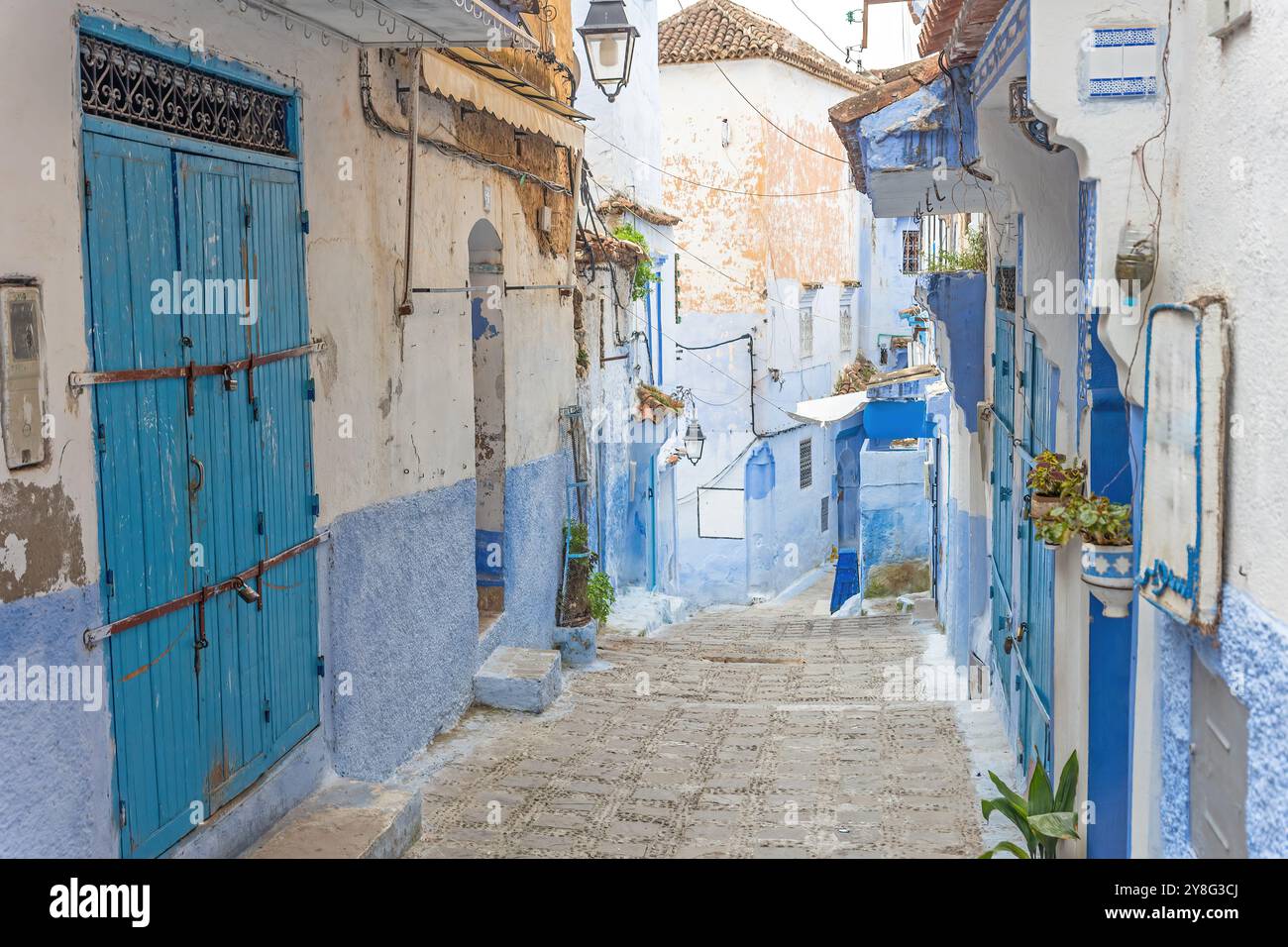 Traditional alley in the historic blue town Chefchaouen in Morocco ...