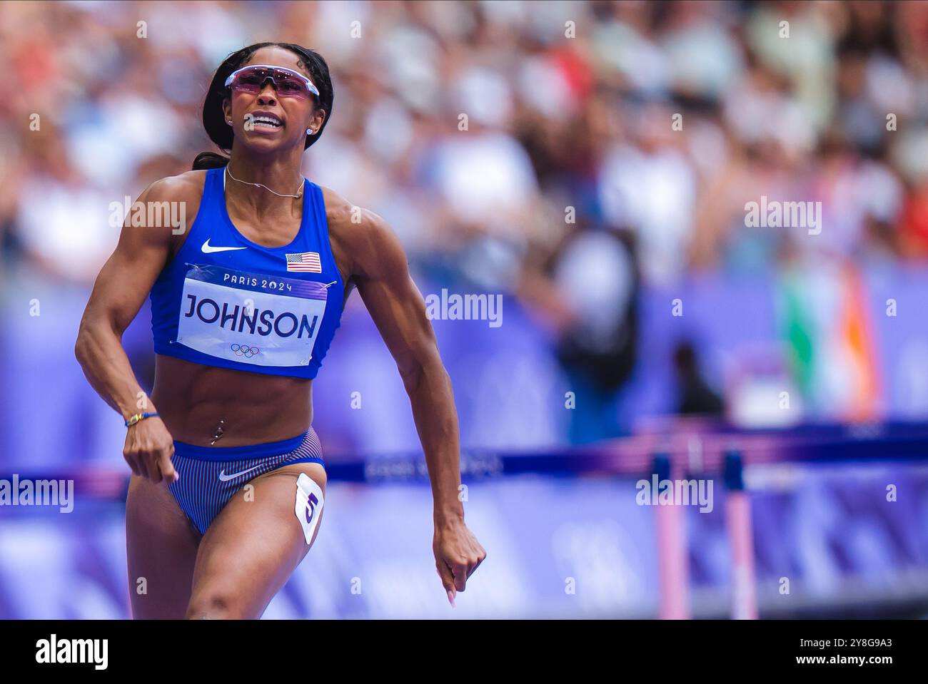 Alaysha Johnson participating in the 100 meters hurdles at the Paris ...