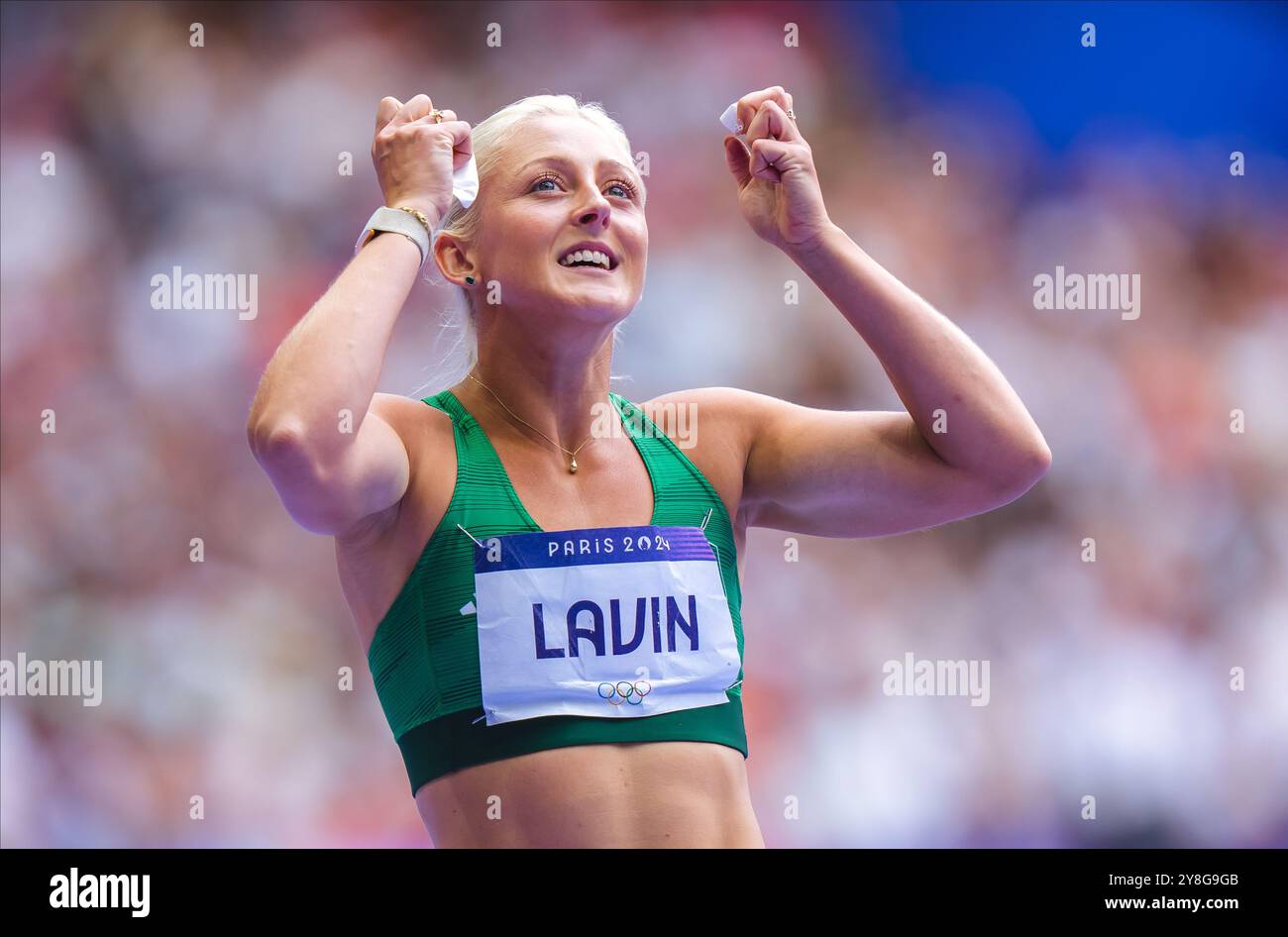 Sarah Lavin participating in the 100 meters hurdles at the Paris 2024 ...