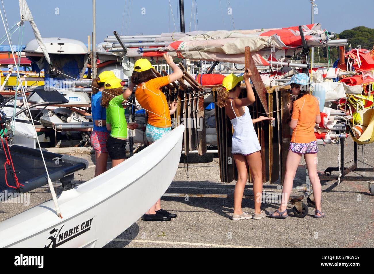 Preparing the boats at the teenage girls sailing school Stock Photo - Alamy