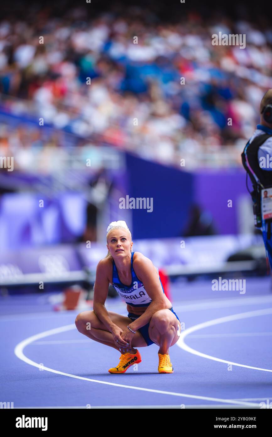 Lotta Harala participating in the 100 meters hurdles at the Paris 2024 ...