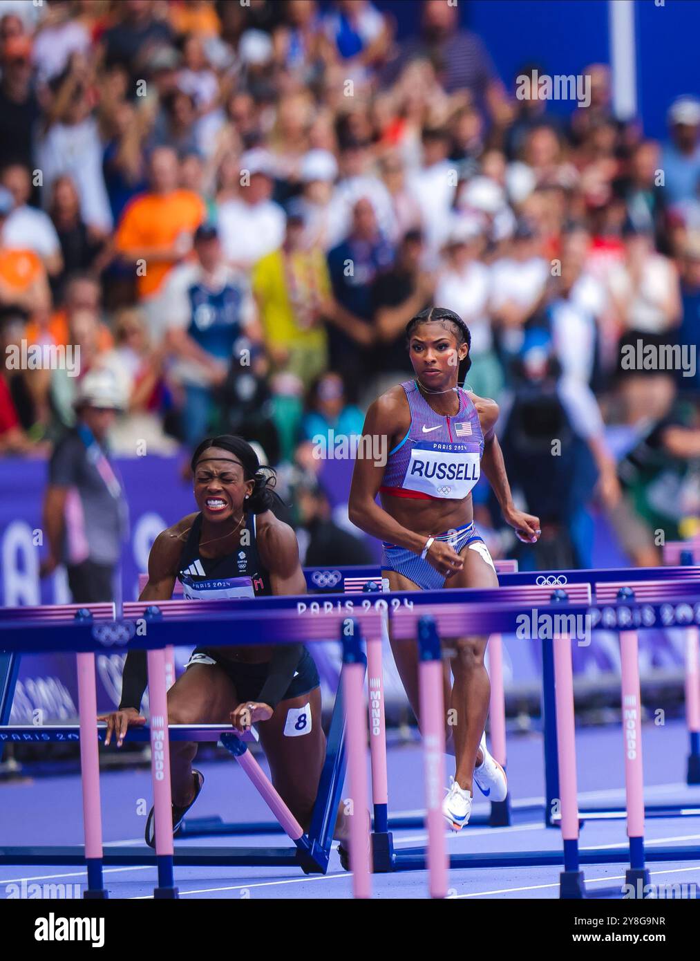 Masai Russell participating in the 100 meters hurdles at the Paris 2024 ...