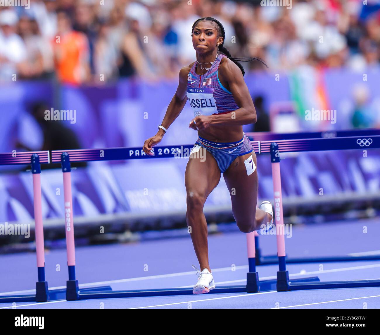 Masai Russell participating in the 100 meters hurdles at the Paris 2024 ...
