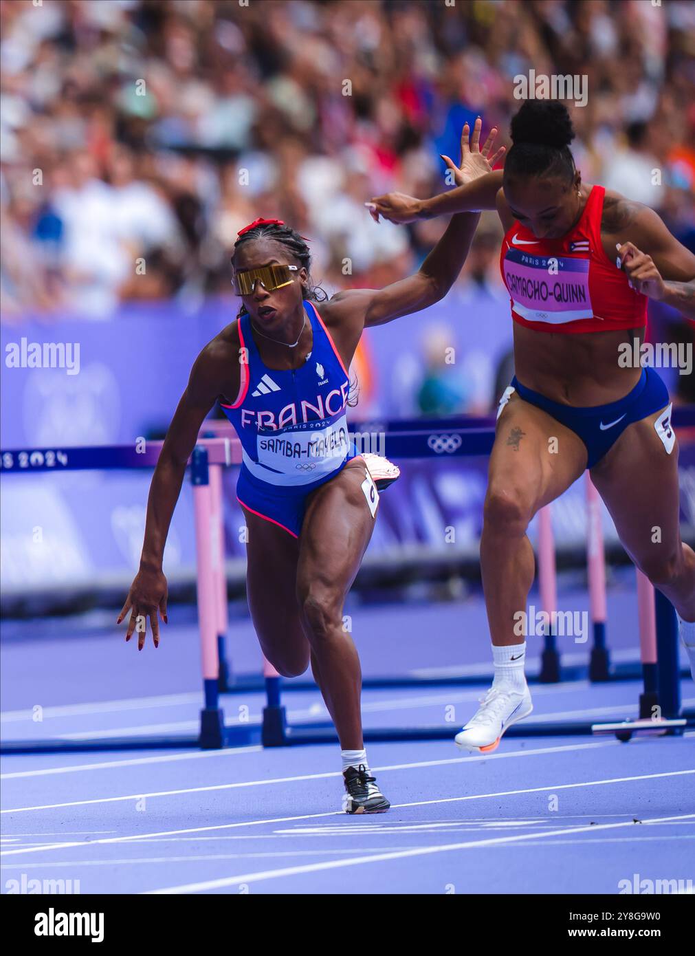 Cyréna Samba-Mayela participating with the flag of their country in the ...