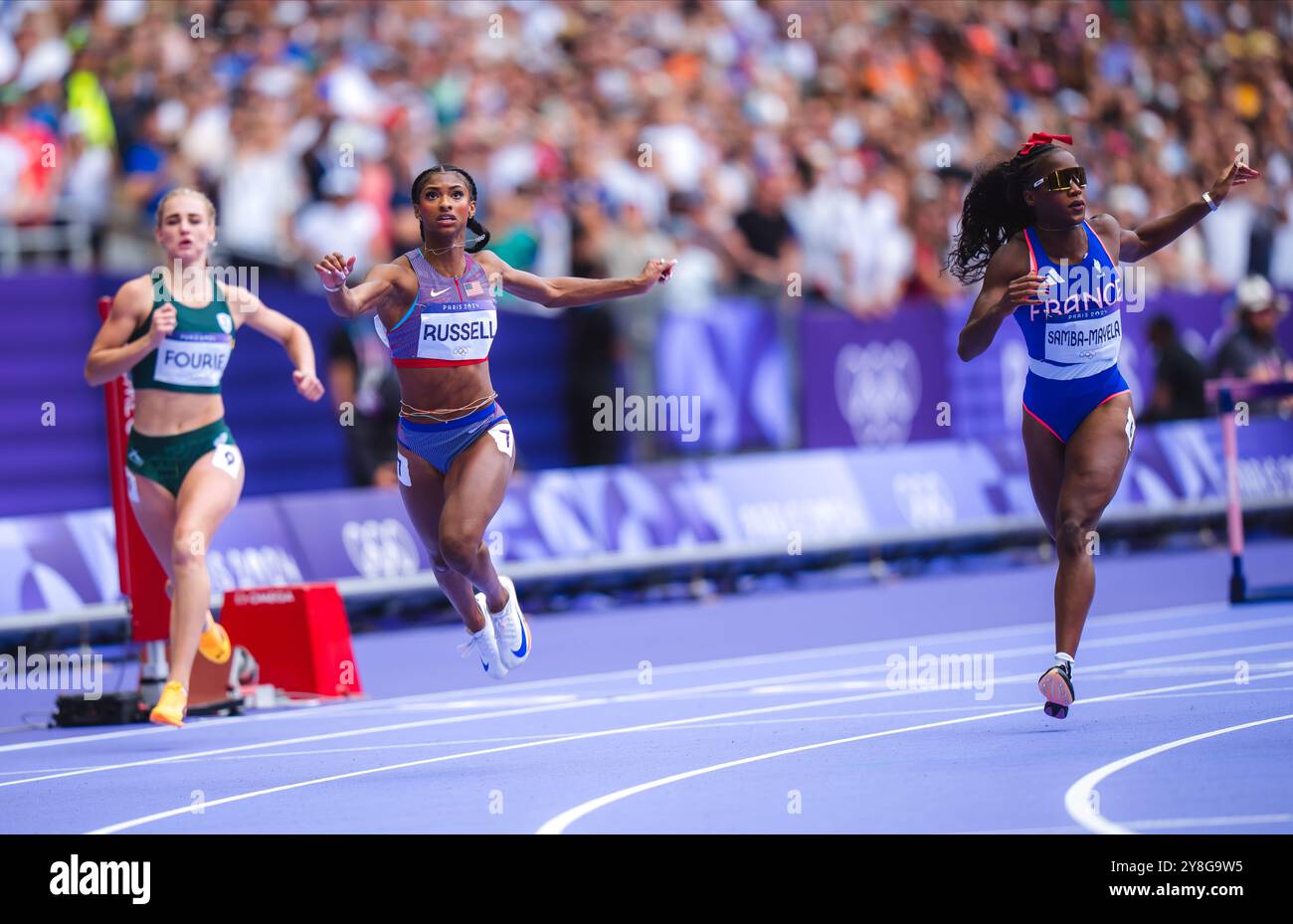 Masai Russell participating in the 100 meters hurdles at the Paris 2024 ...
