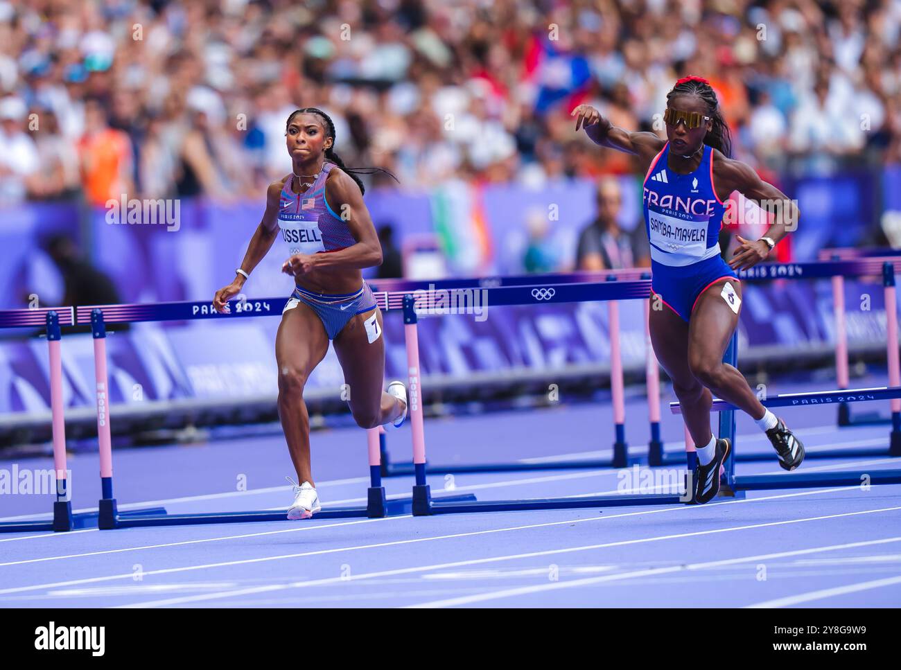 Masai Russell participating in the 100 meters hurdles at the Paris 2024 ...