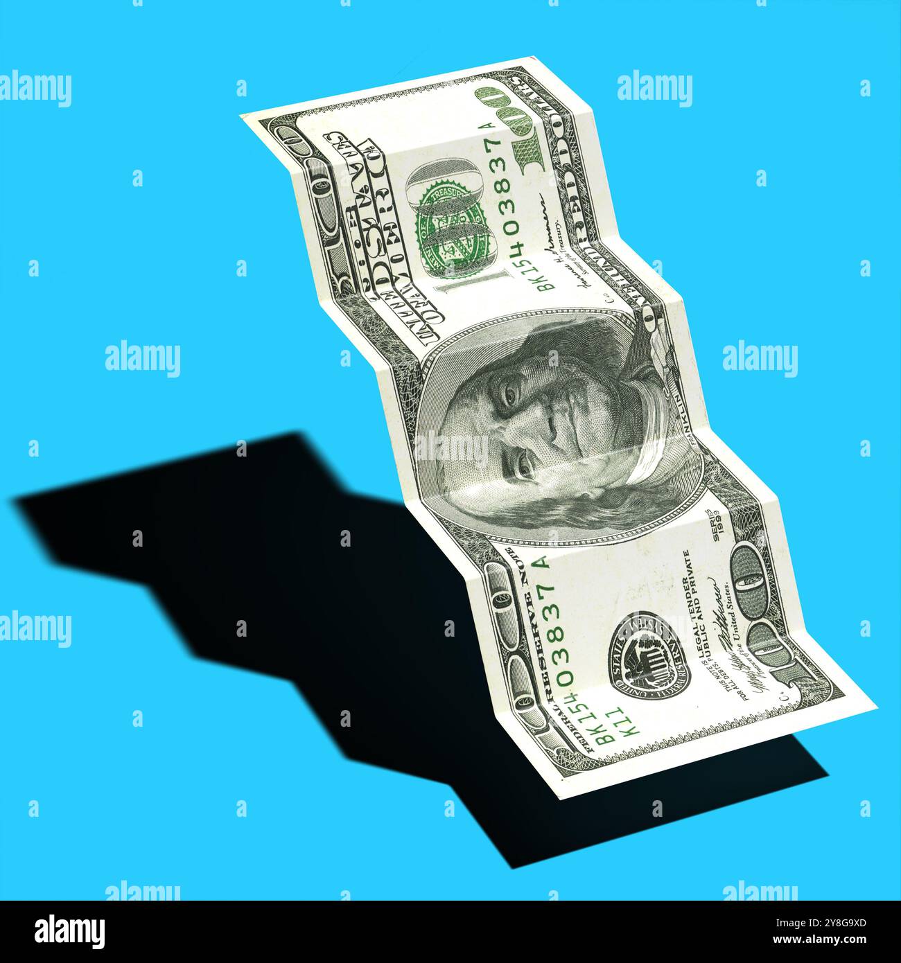 A 100 dollar bill being folded like a graph bar - concept for inflation ...