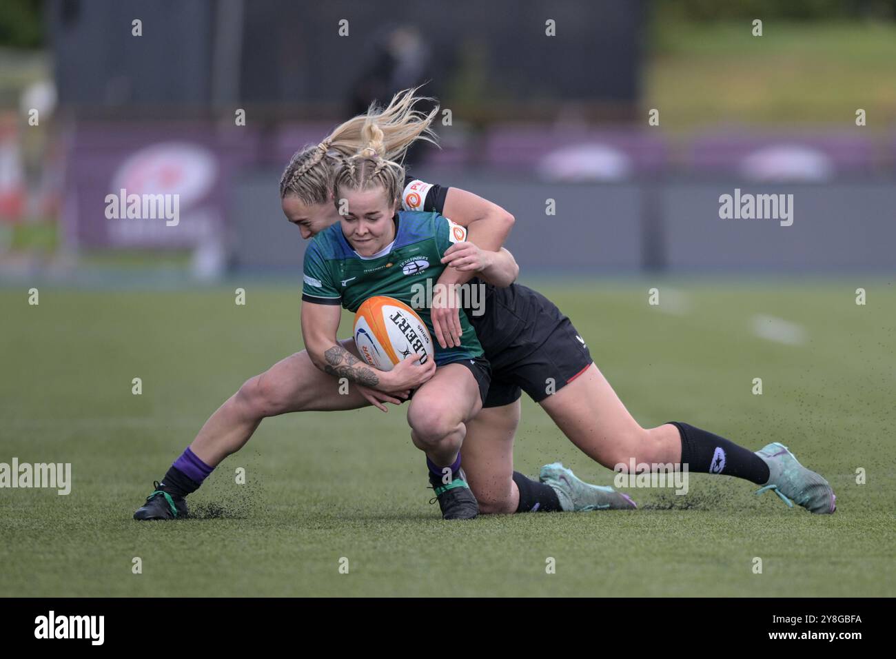 Emma Hardy of Saracens Women tackles Grace White of Trailfinders Women ...