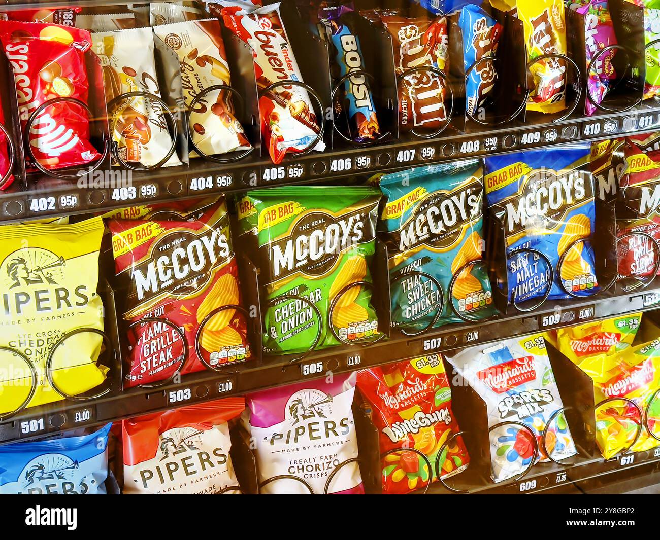 Vending machine containing crisps and sweets to purchase Stock Photo ...