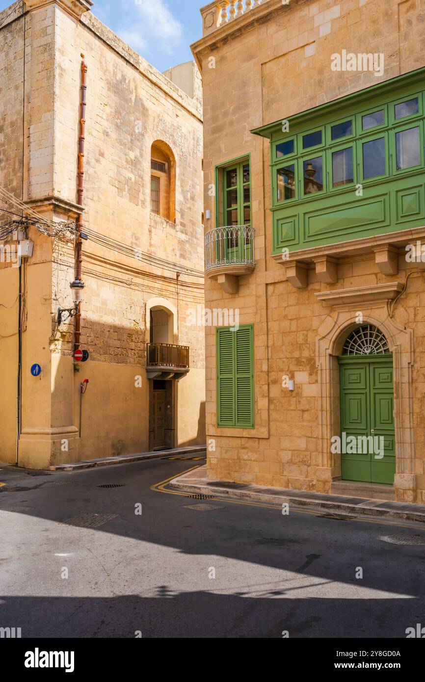 Traditional Maltese buildings with colourful balconies in historic city ...