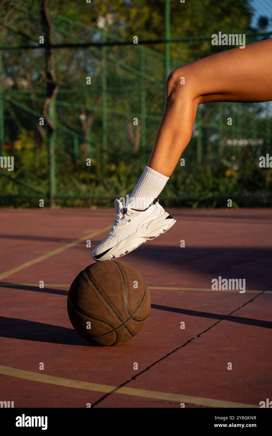 Female leg and basketball ball on the playground Stock Photo - Alamy