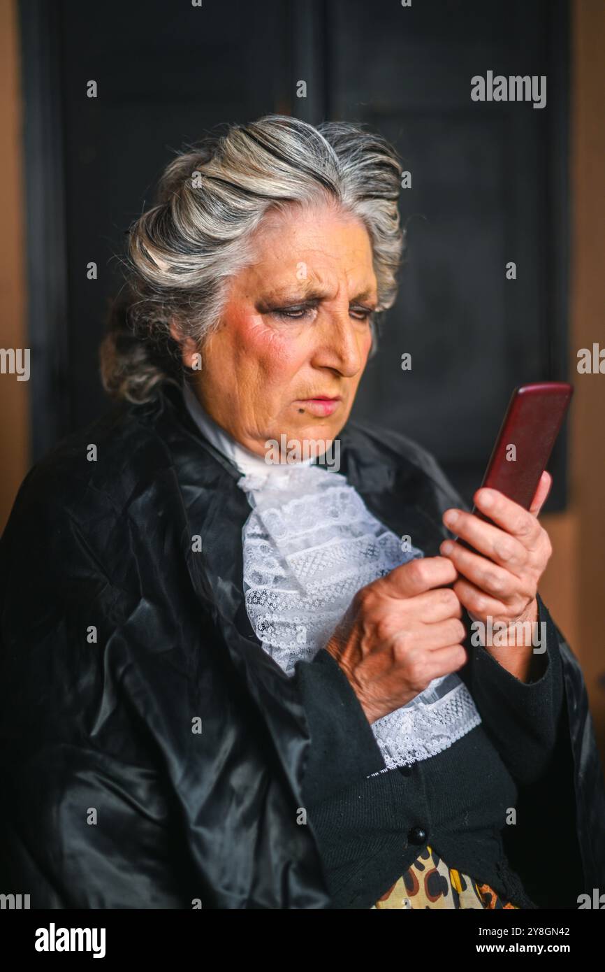 Mature female judge is frowning while struggling to use an old flip ...