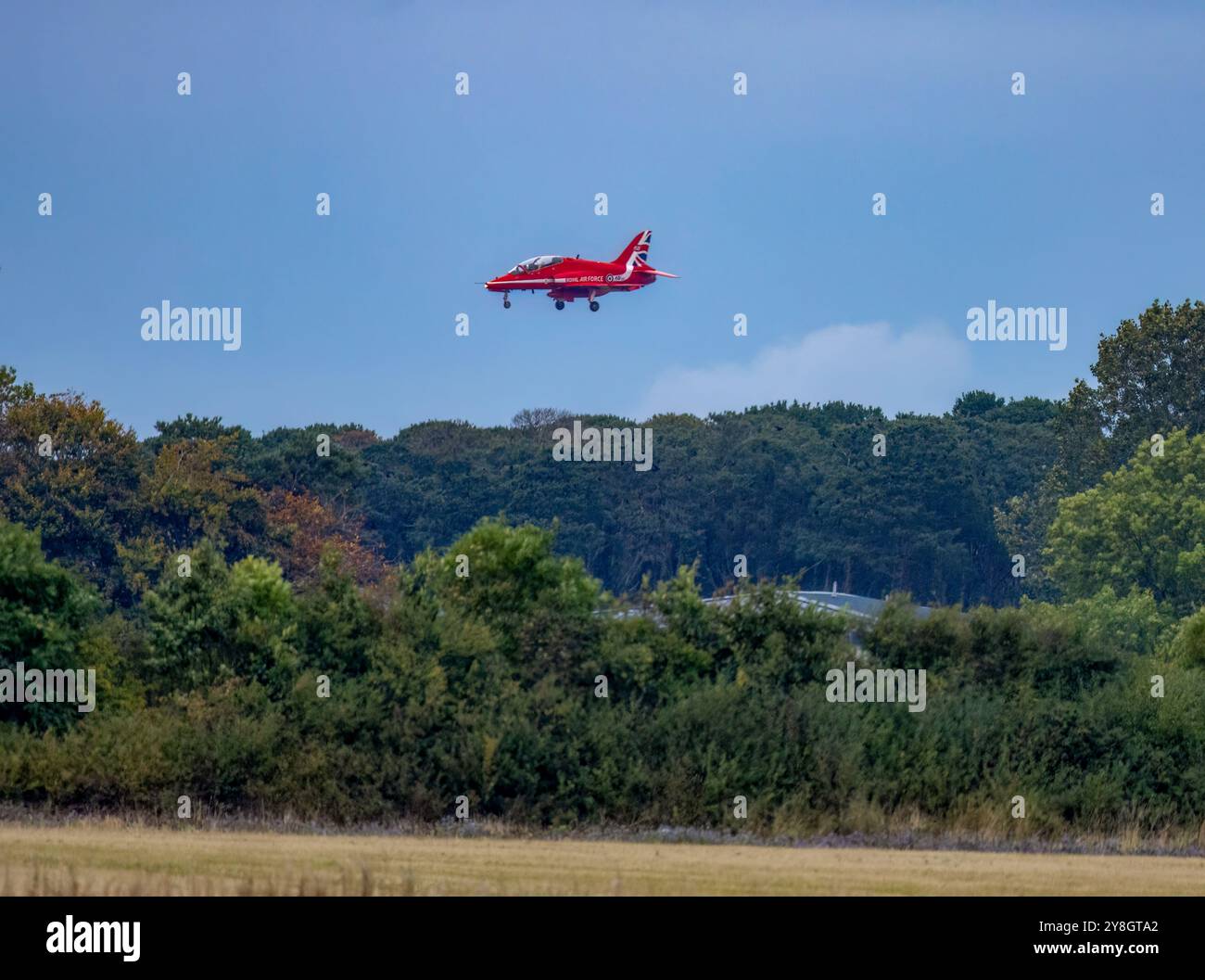 Royal Air Force red arrow jet coming in to land on the runway over ...