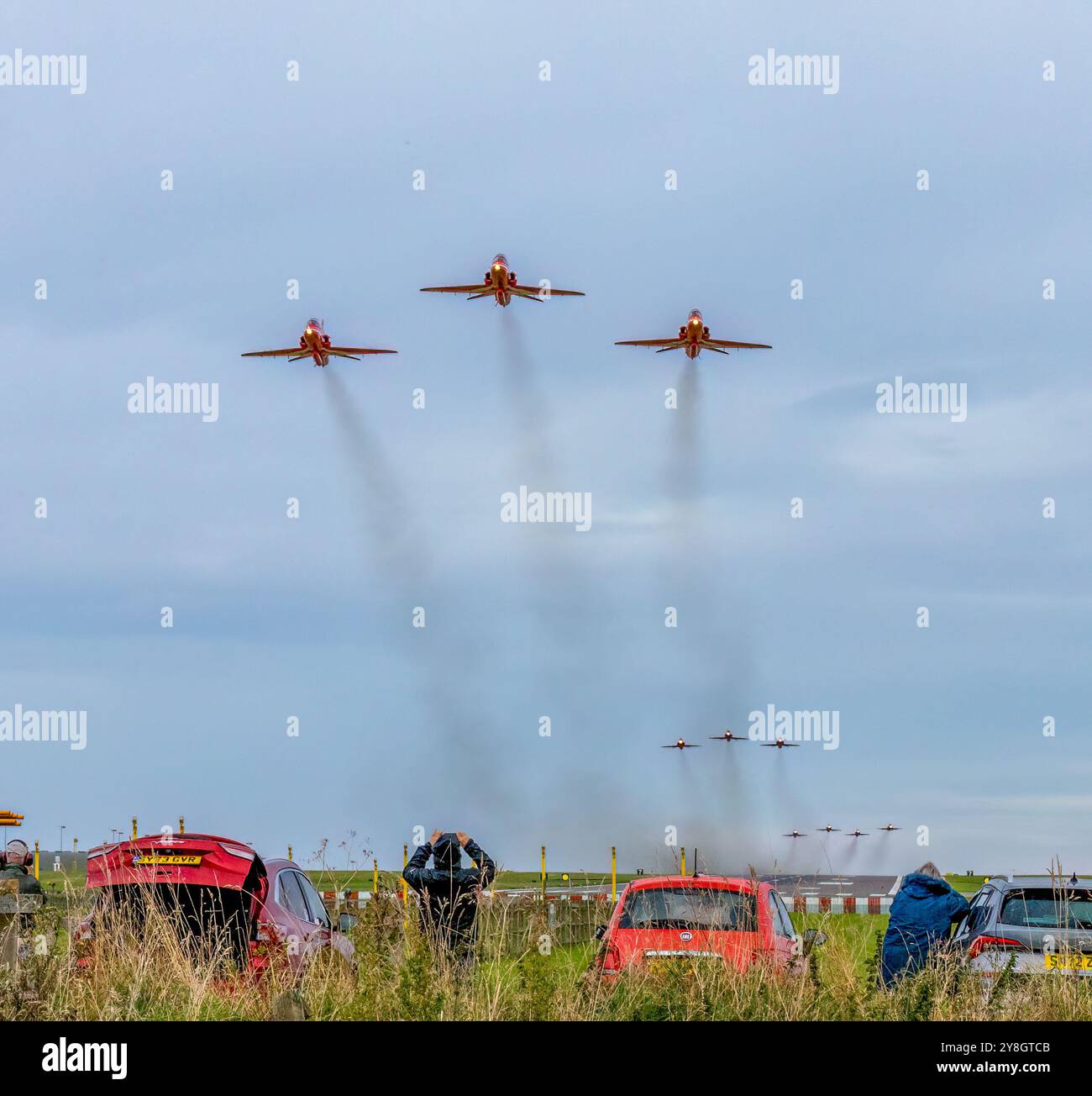 Plane spotters watching the Royal Air Force red arrows display team ...